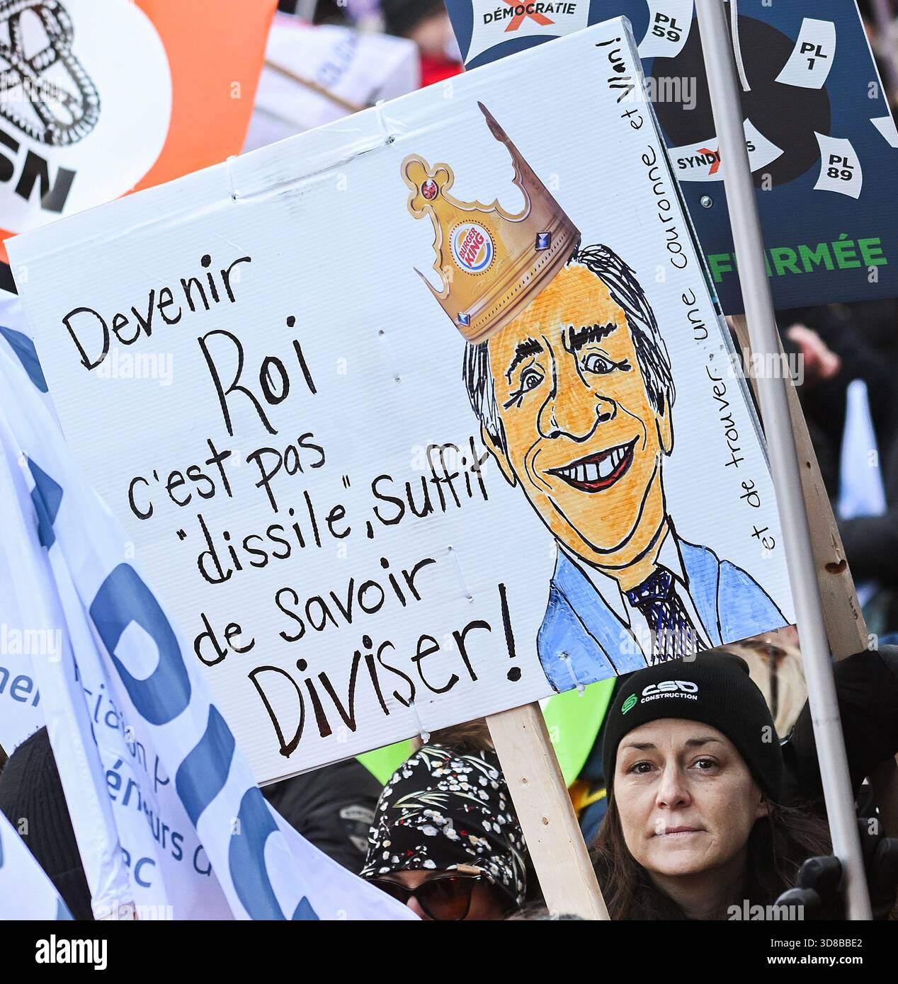 People take part in a protest organized by multiple union groups ...