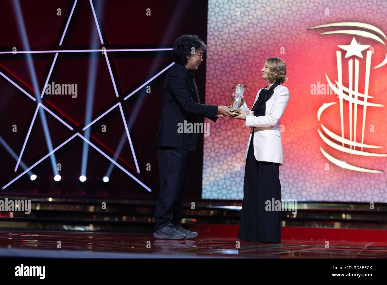 Jury president Bong Joon-ho, Jodie Foster receives the Tribute Award attends the 22nd Marrakech ...