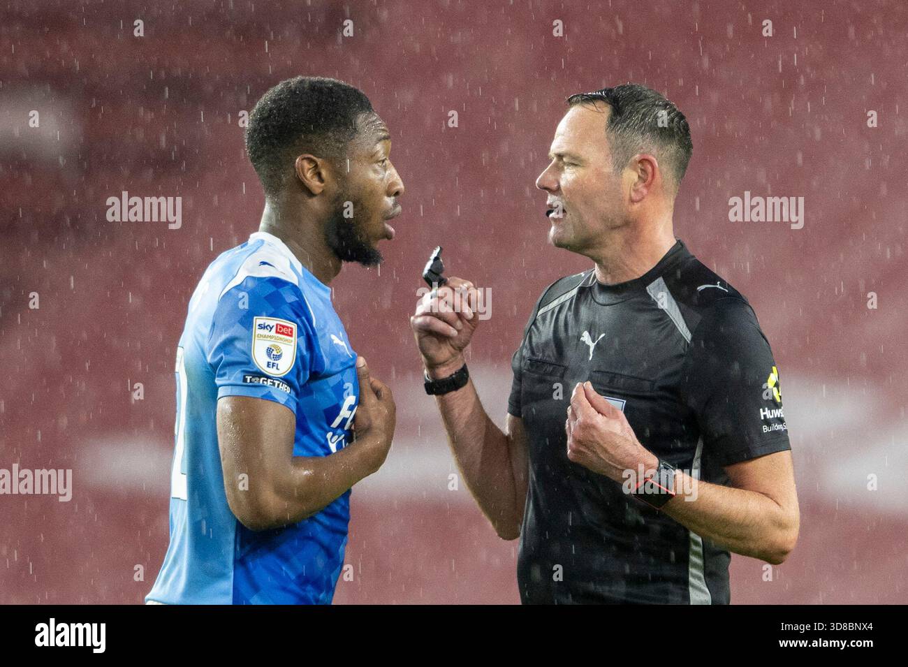 Referee James Linnington has a word with Ebou Adams of Derby County ...