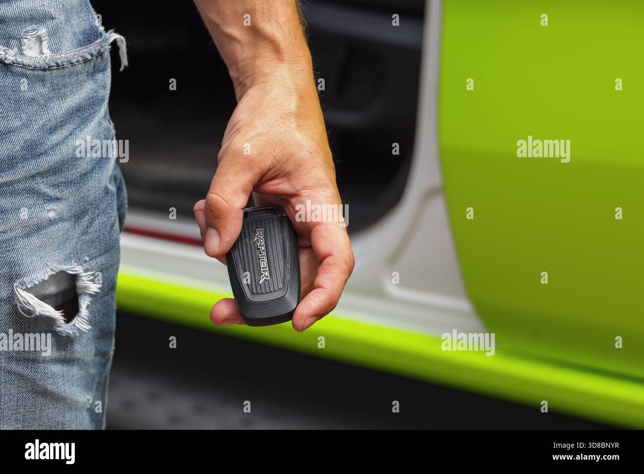 Slovenia, Ljubljana - 3 September 2025: A dealership person is holding ...