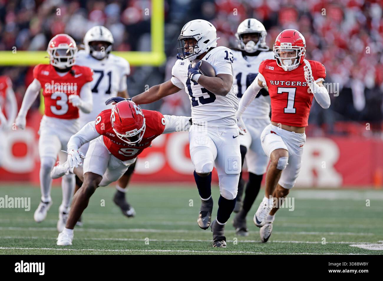 Penn State running back Kaytron Allen is tackled by Rutgers defensive ...