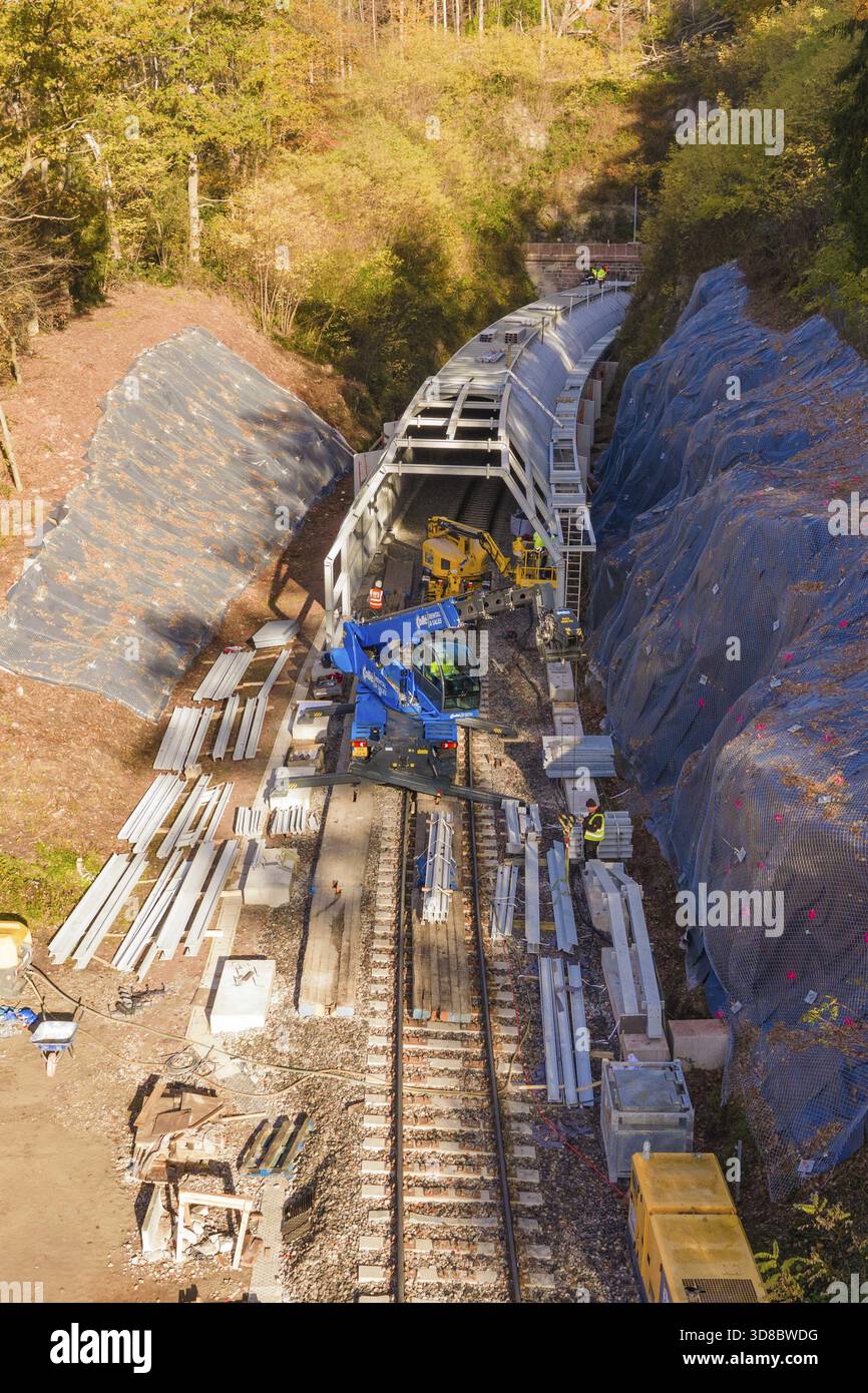 Aerial view of a construction site with railroad tracks and tunnel ...