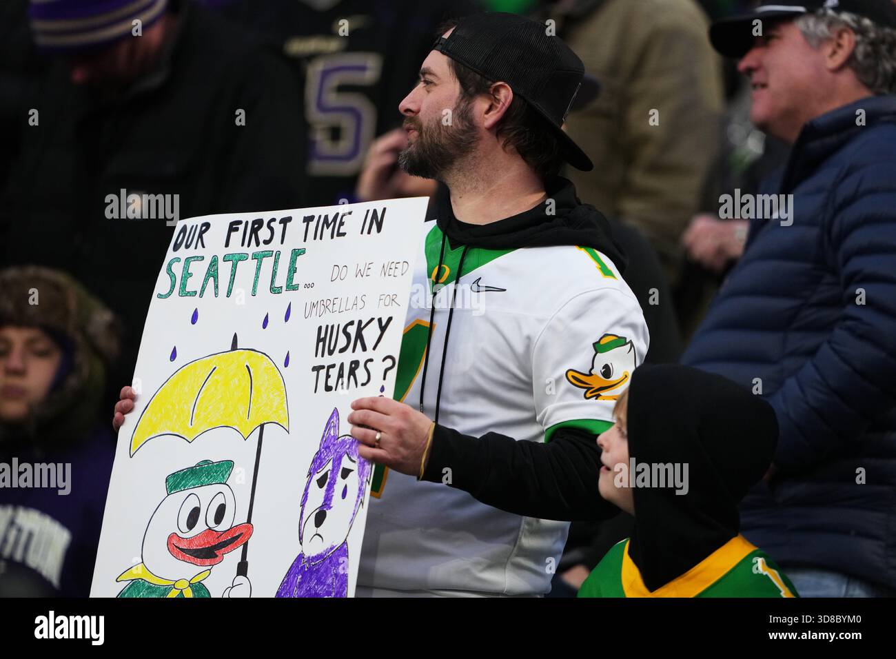 An Oregon fan waves a sign during the second half of an NCAA college ...