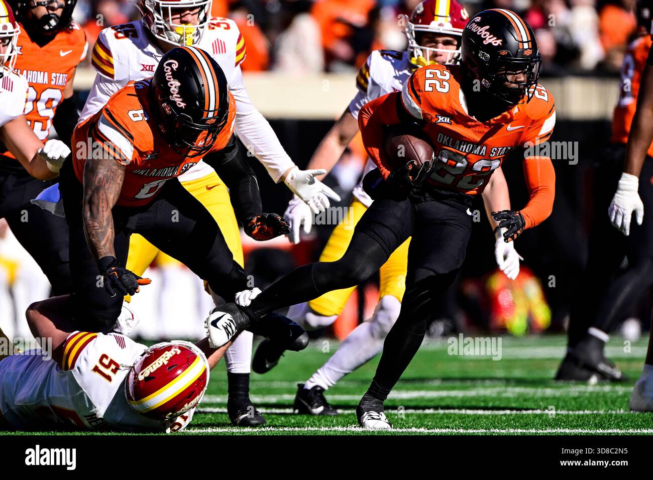 Oklahoma State running back DJ Dugar Jr. (22) tackle by Iowa State linebacker Nick Reinicke (51 ...