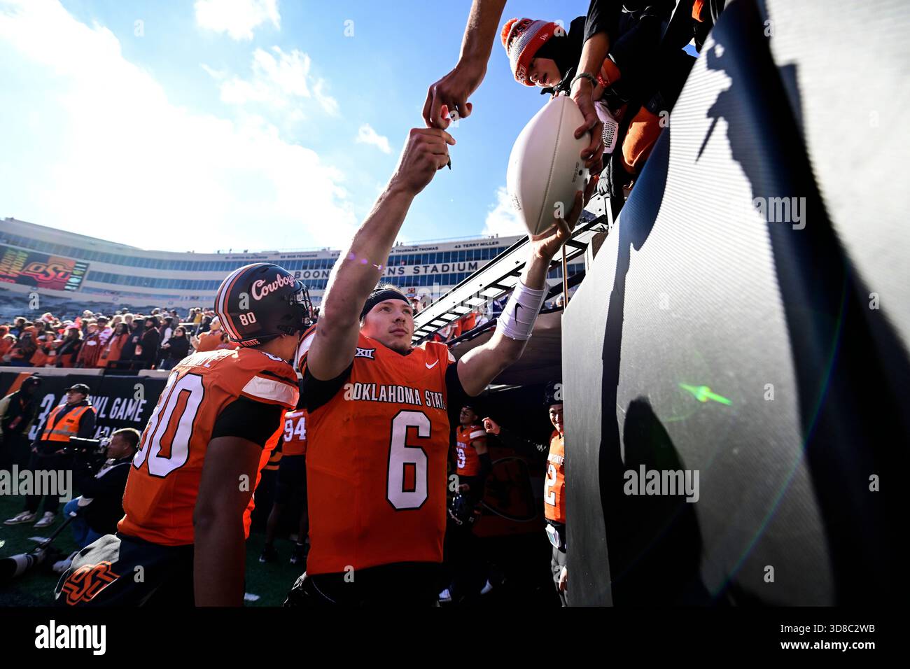 Oklahoma State quarterback Zane Flores (6) hands over a sign ball after the second half of an ...