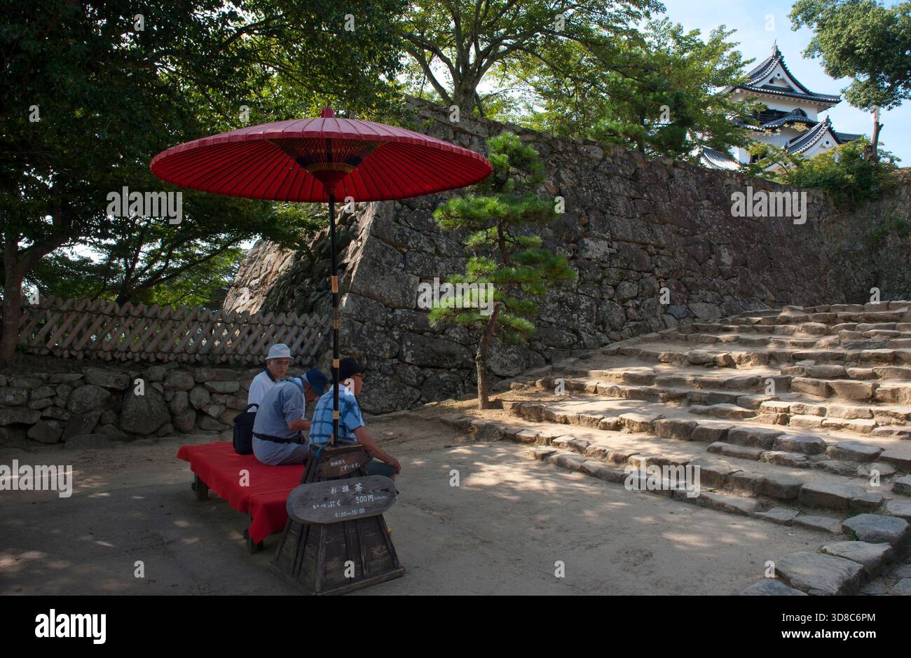 Stone steps and ishigaki stone castle walls leading up to Hikone Castle ...