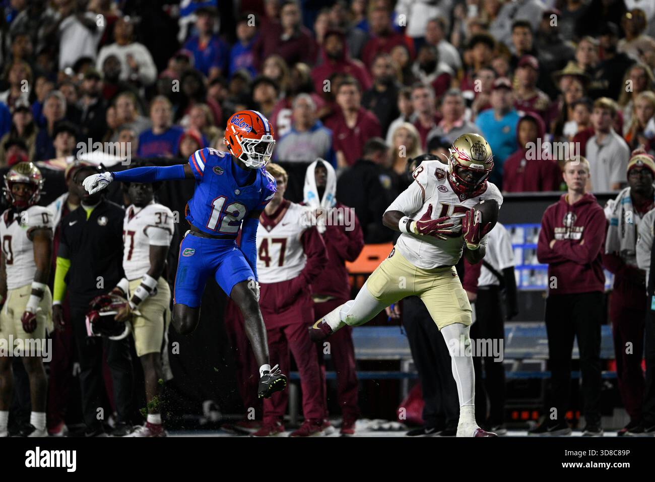 Florida State tight end Randy Pittman Jr. (13) catches a pass past Florida defensive back Ben ...