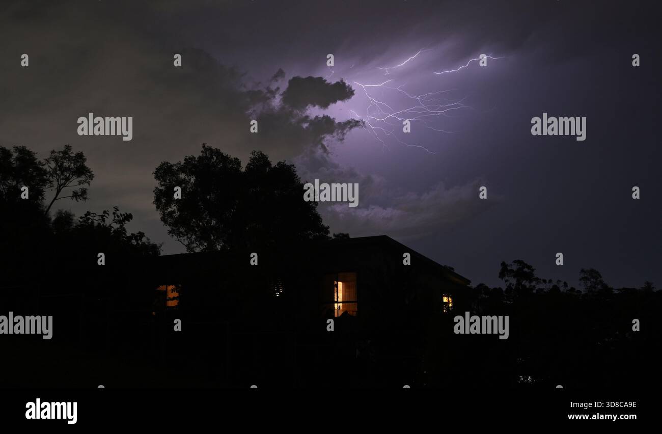 Lightning is seen as a tropical storm passes through the Gold Coast ...