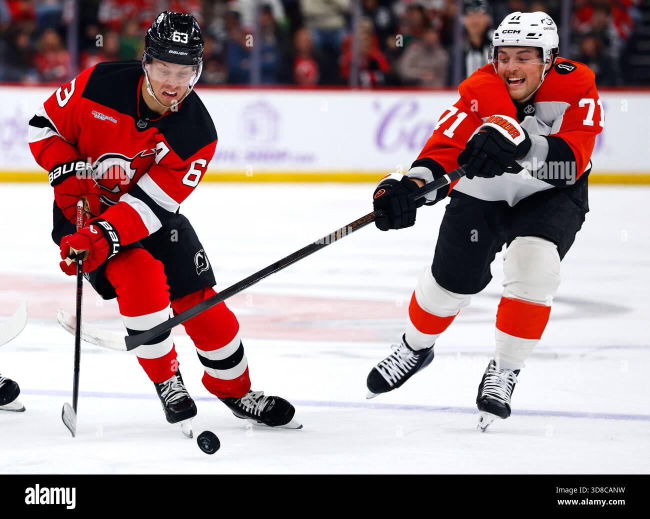 New Jersey Devils left wing Jesper Bratt (63) plays the puck against ...