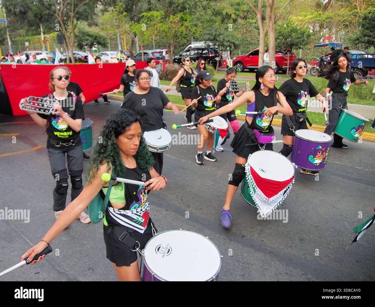Women march playing drums when dozens take to the streets of Lima ...