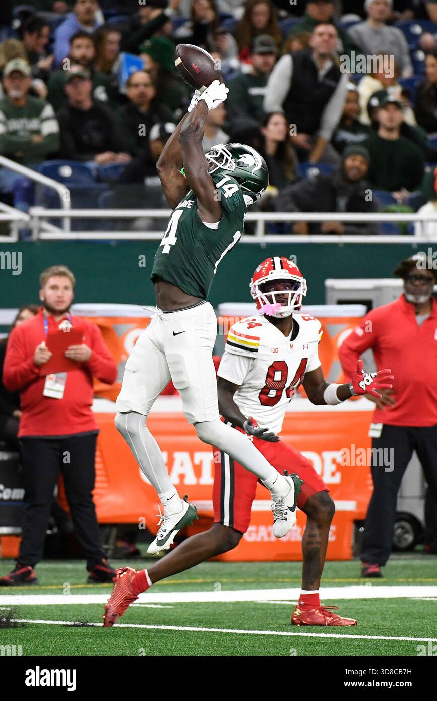 Michigan State defensive back Malcolm Bell, left, leaps and knocks away ...