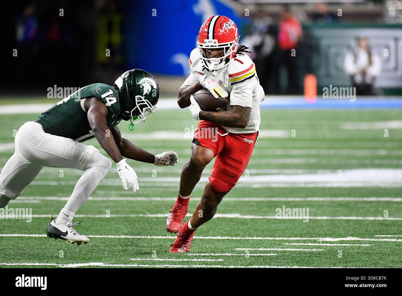 Maryland wide receiver Jalil Farooq, right, runs with the ball as he is ...
