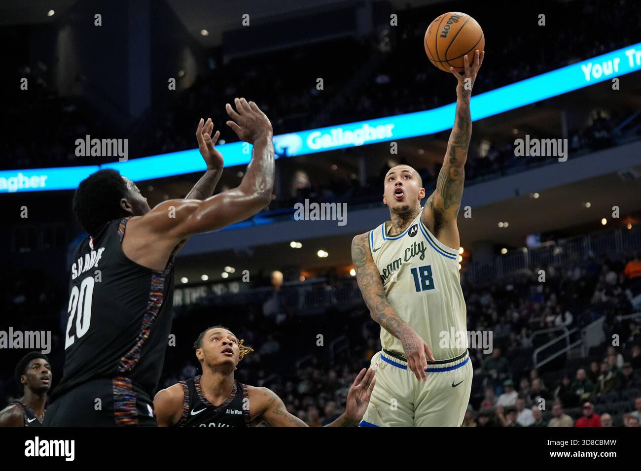 Milwaukee Bucks' Kyle Kuzma (18) shoots against Brooklyn Nets' Day'Ron ...