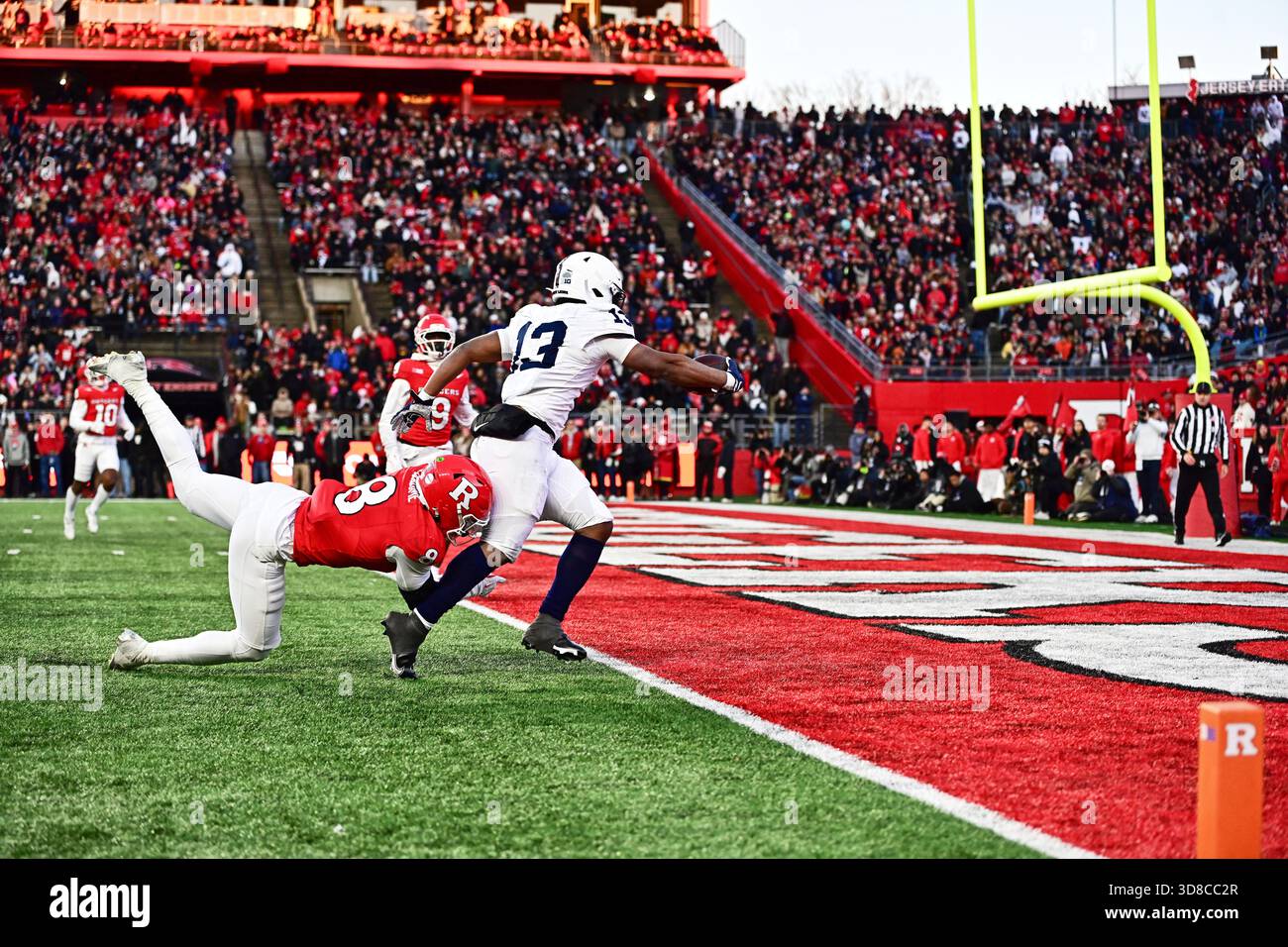 Penn State running back Kaytron Allen, right, crosses the goal line ...