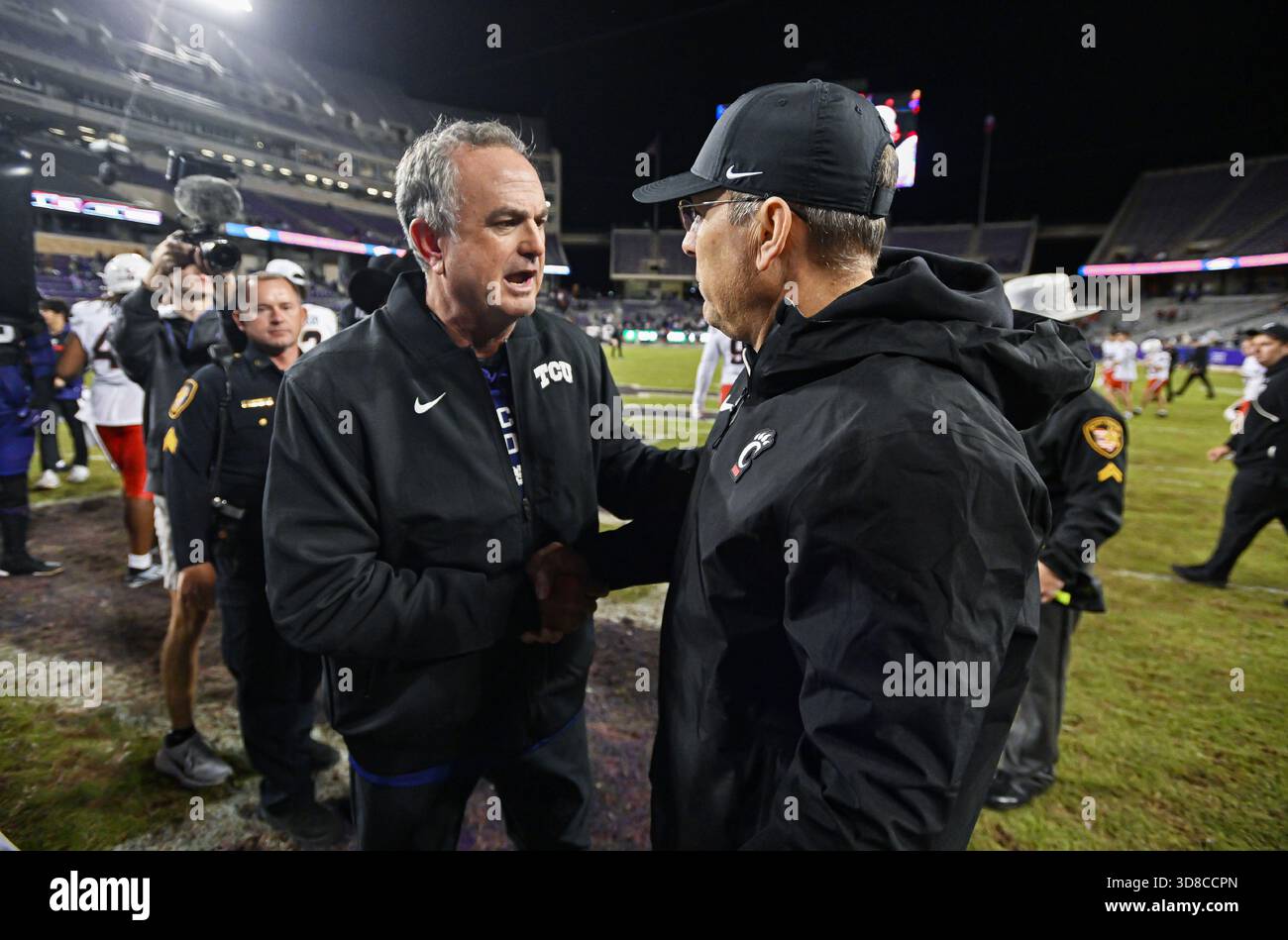 November 29, 2025: TCU Horned Frogs coach Sonny Dykes (left) shakes ...