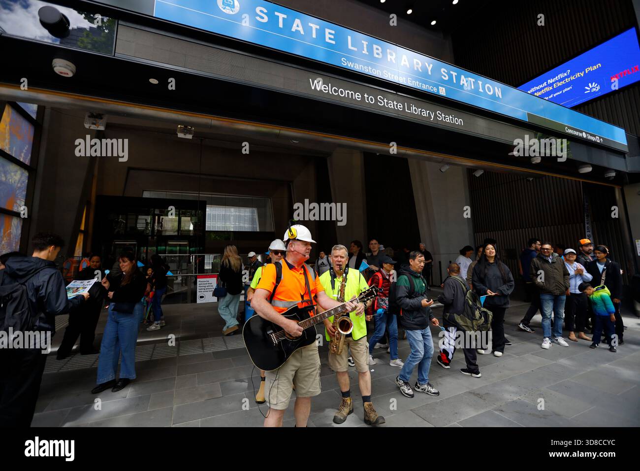 People are seen outside State Library Station. The Metro Tunnel ...