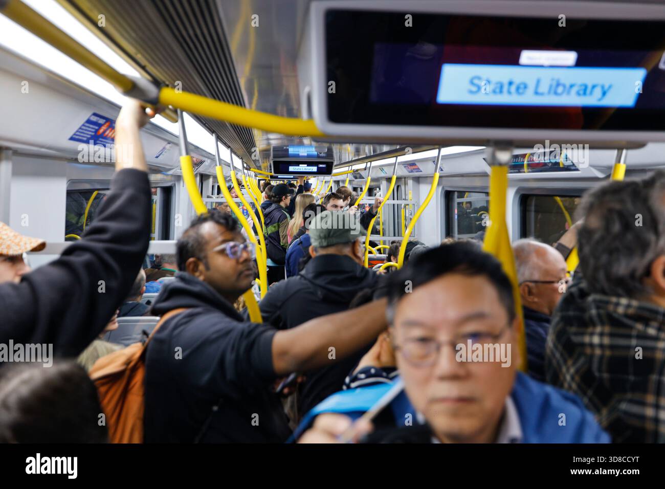 People crowd onto a train as Metro Tunnel services begin. The Metro ...