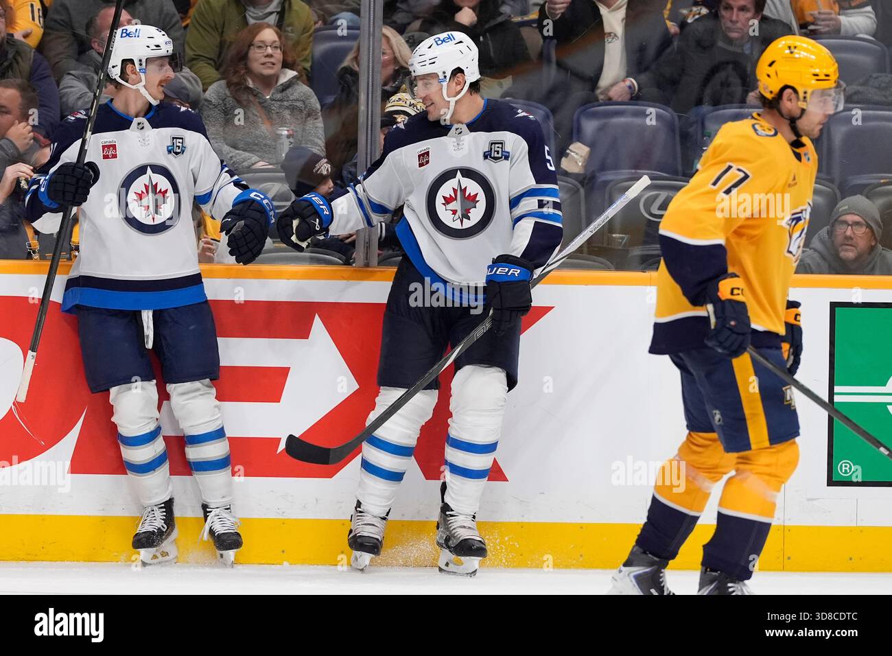 Winnipeg Jets left wing Kyle Connor, left, celebrates his goal with ...