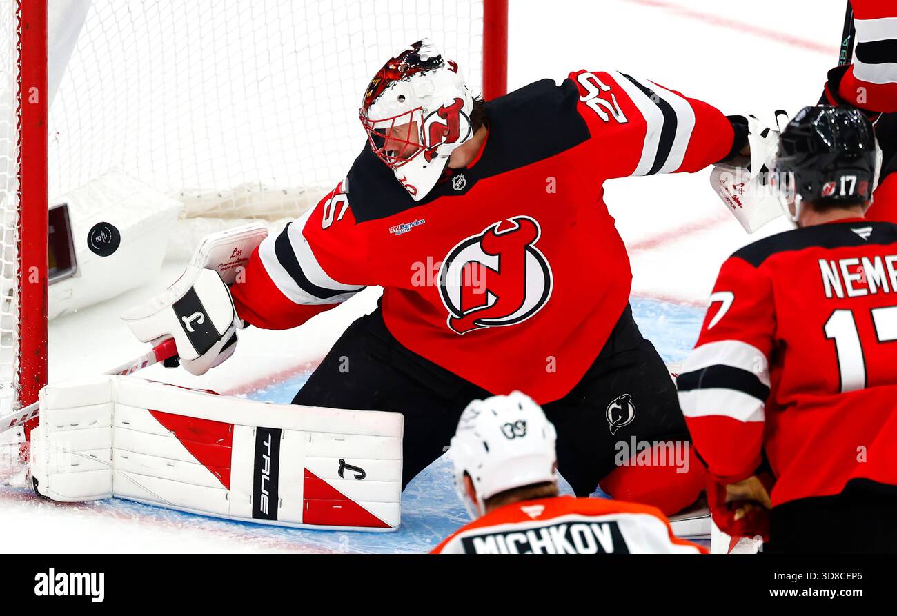 New Jersey Devils goaltender Jacob Markstrom (25) makes a save against ...