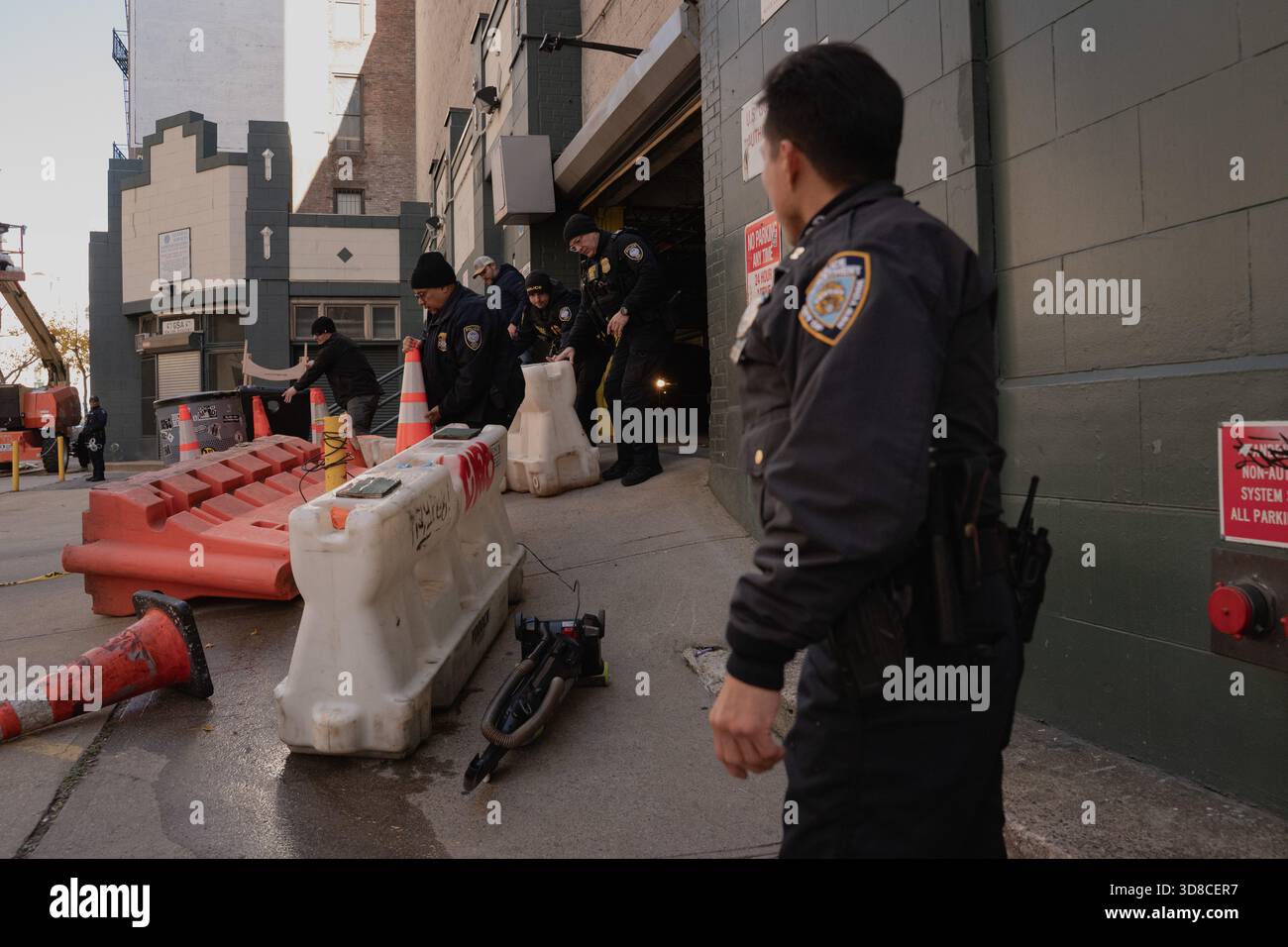 Manhattan, United States. 29th Nov, 2025. DHS officers clear a path for ...