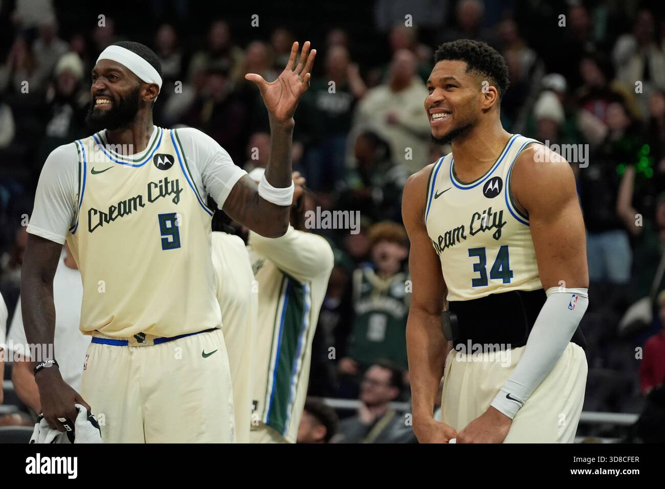 Milwaukee Bucks' Giannis Antetokounmpo (34) and Bobby Portis (9) smile ...