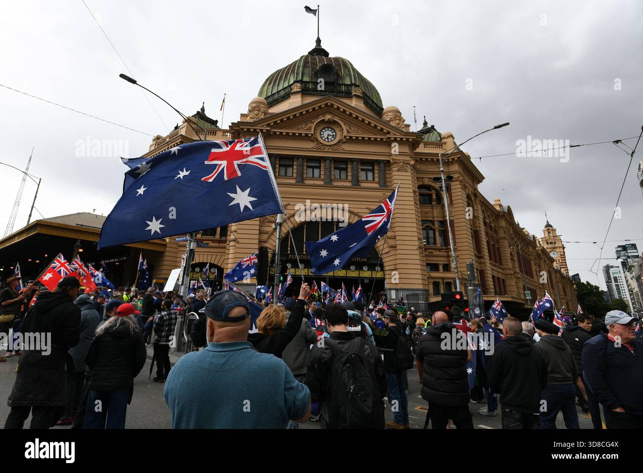 Protesters gather at Flinders Street Station for a 'Put Australia First ...