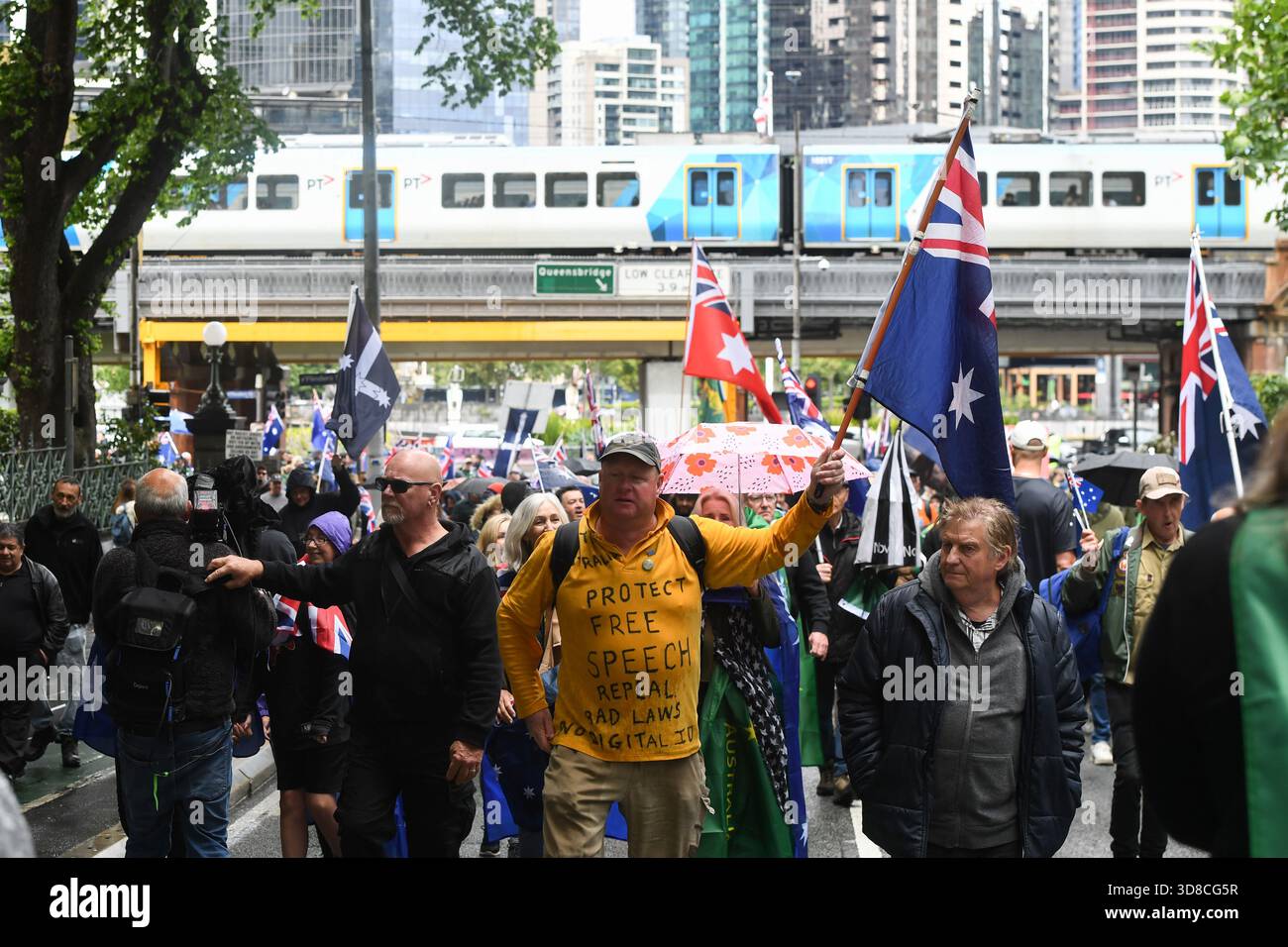 Protesters march during a 'Put Australia First' anti-immigration rally ...