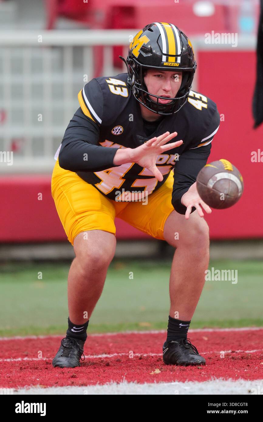 November 29, 2025: Tigers punter John Butcher (43) bends to receive a ...