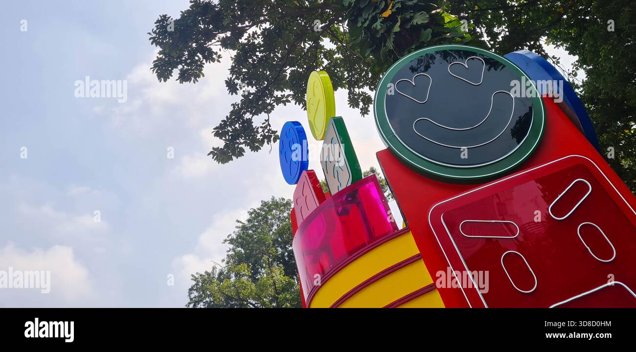 A vibrant modern emoji signboard installation displayed in a public ...