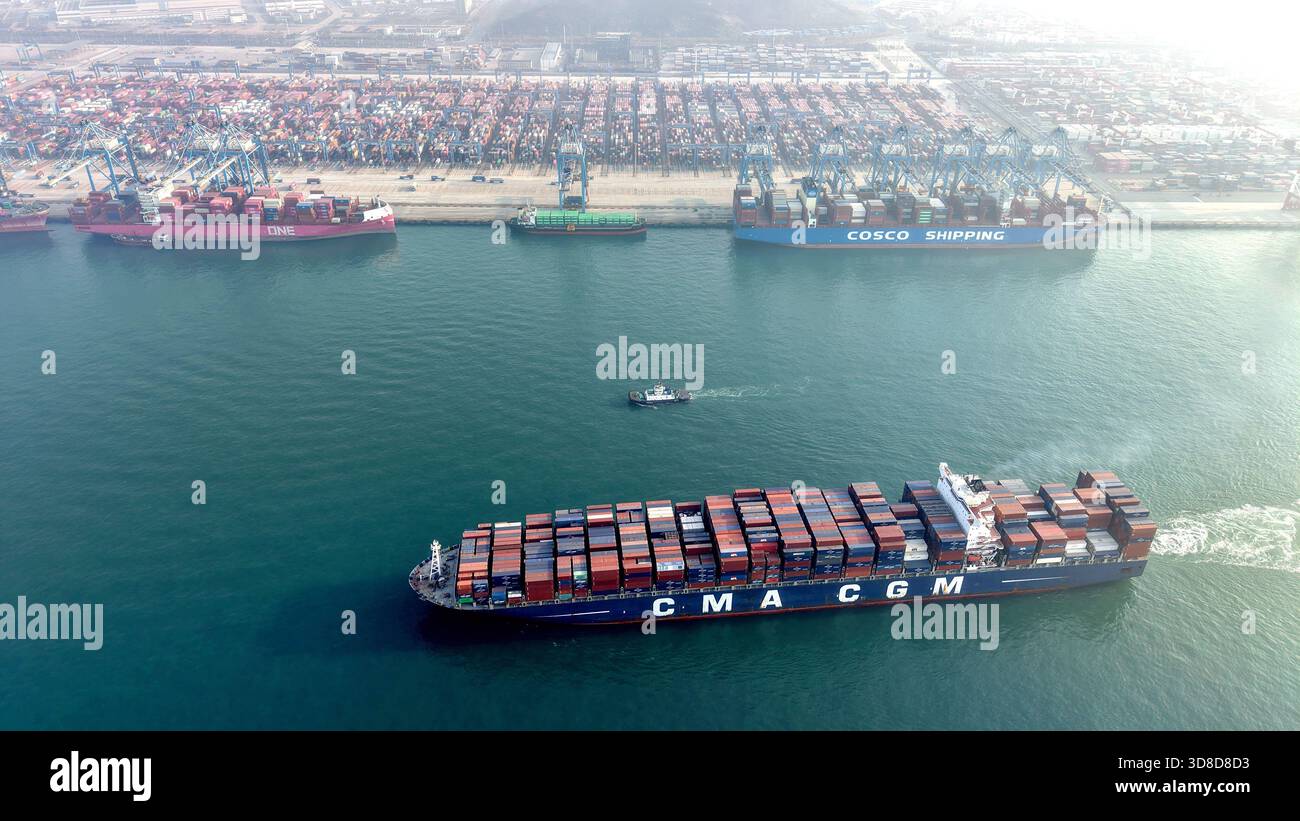 A CMA CGM container ship sails in a harbor in Qingdao in eastern China ...