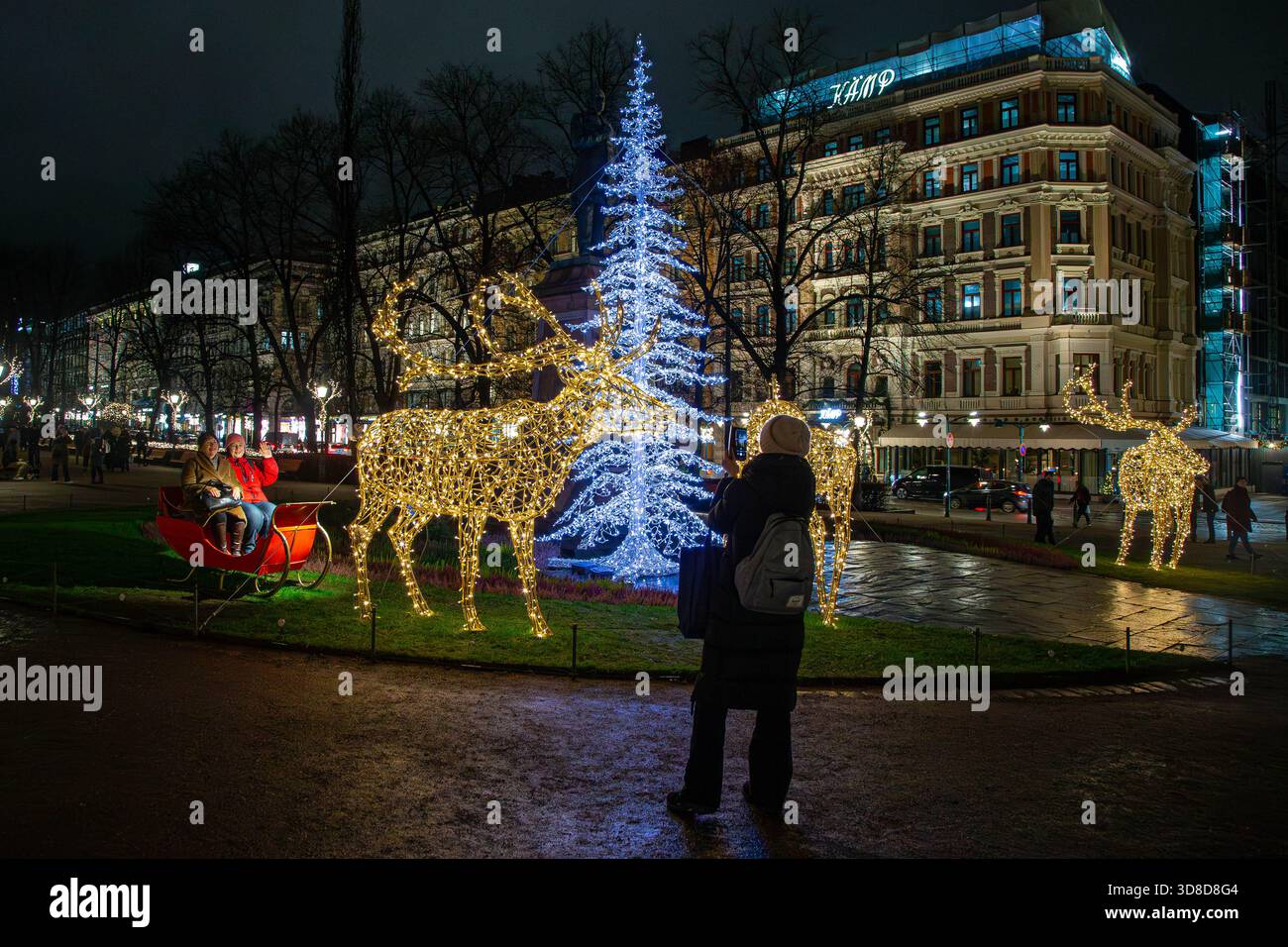 November 29, 2025, Helsinki, Uusimaa, Finland: Visitors photograph ...