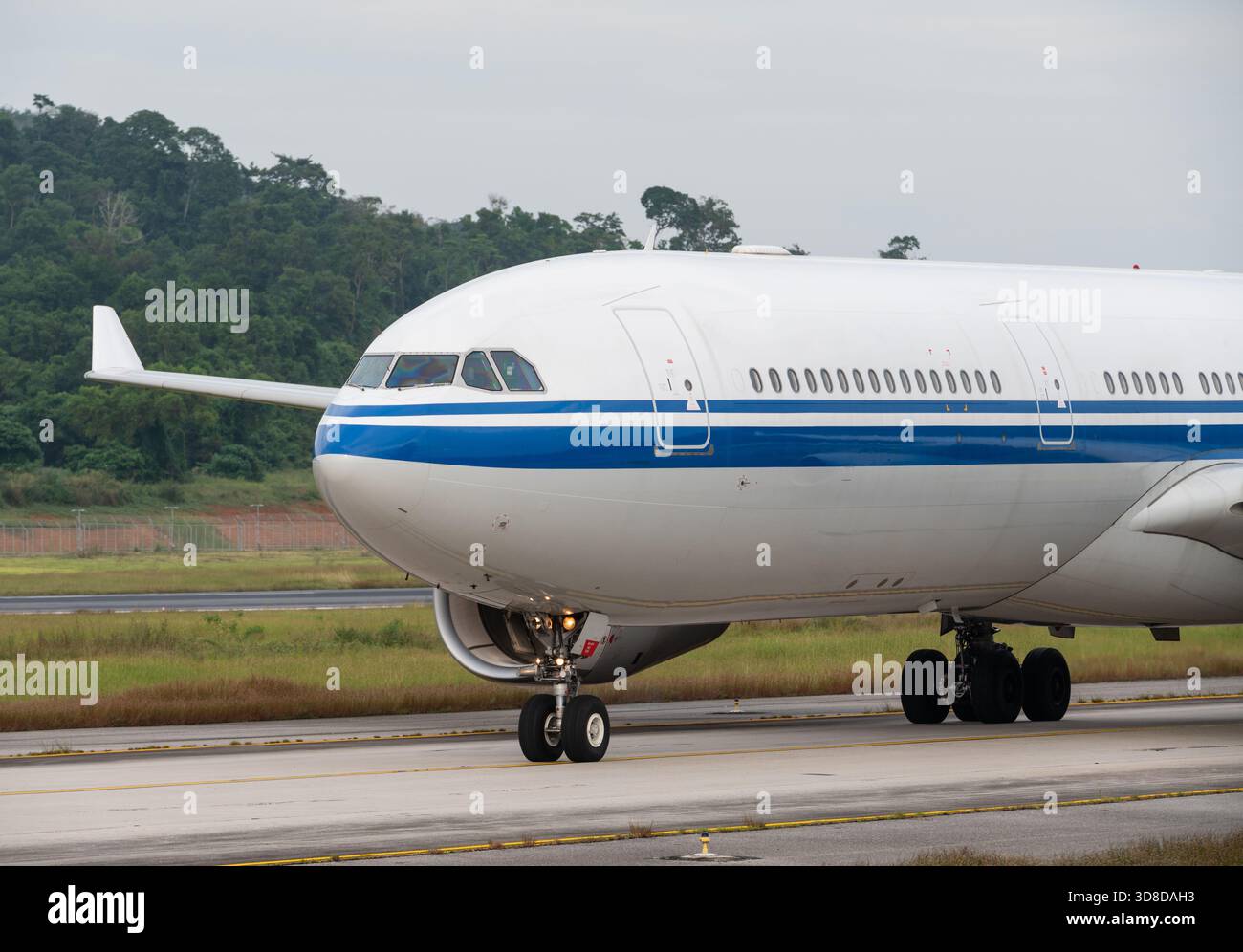 Close up of wide-body passenger plane taxiing on the runway Stock Photo ...