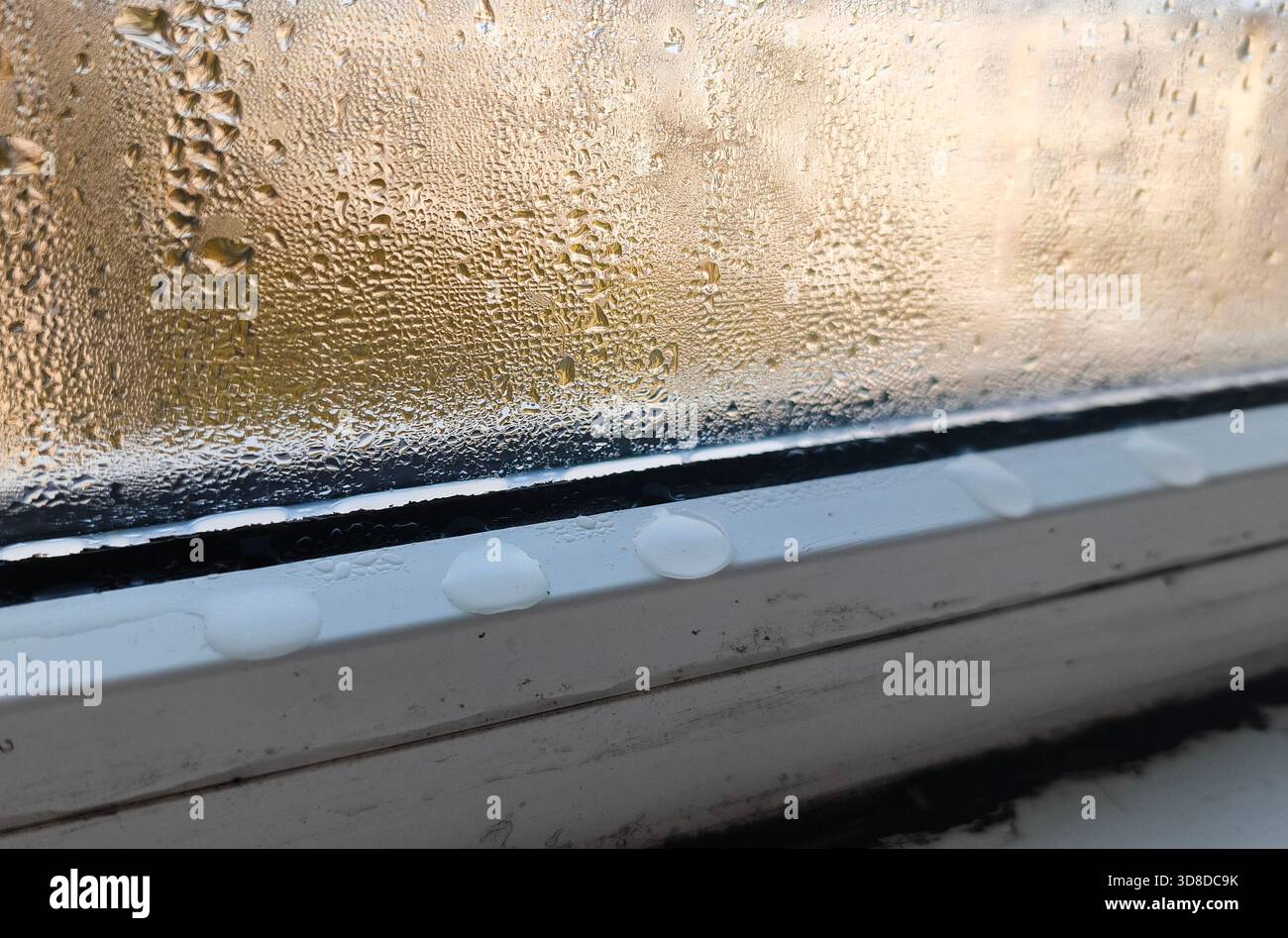Moisture builds up on surface of window with visible condensation ...