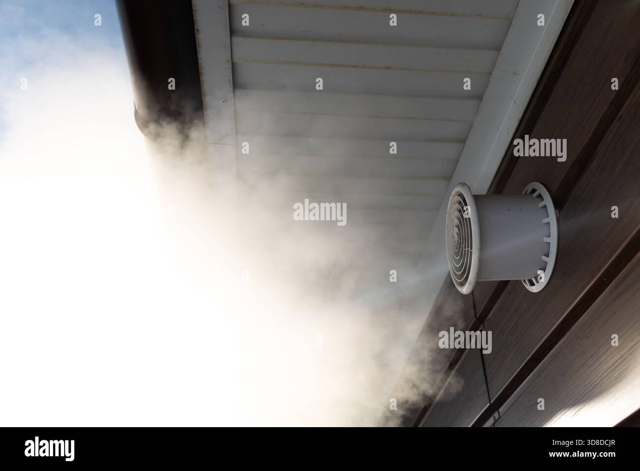 steam exiting exterior vent under eaves, thick white plume from sauna ...