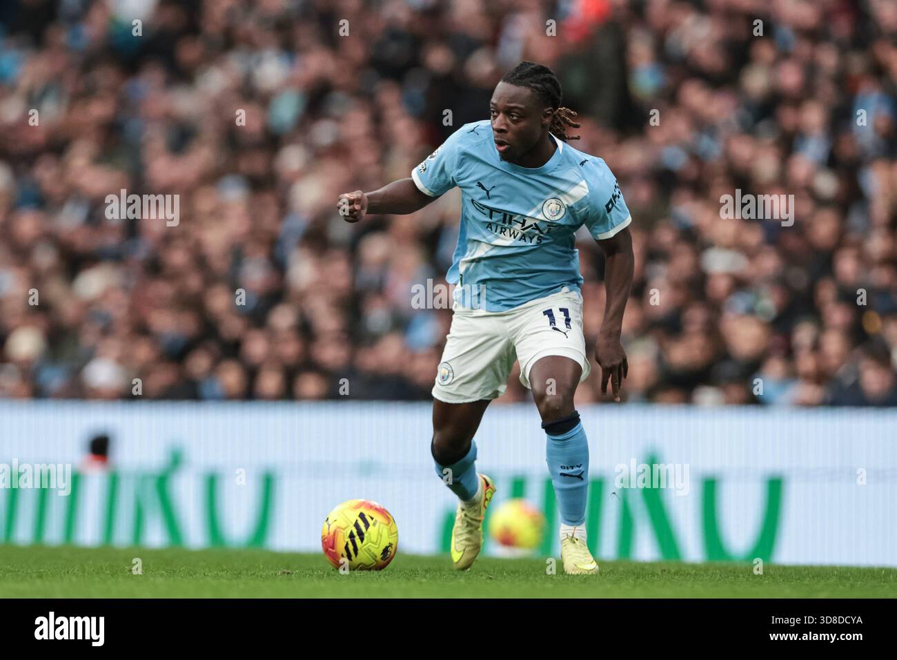Jeremy Doku of Manchester City breaks with the ball during the Premier ...