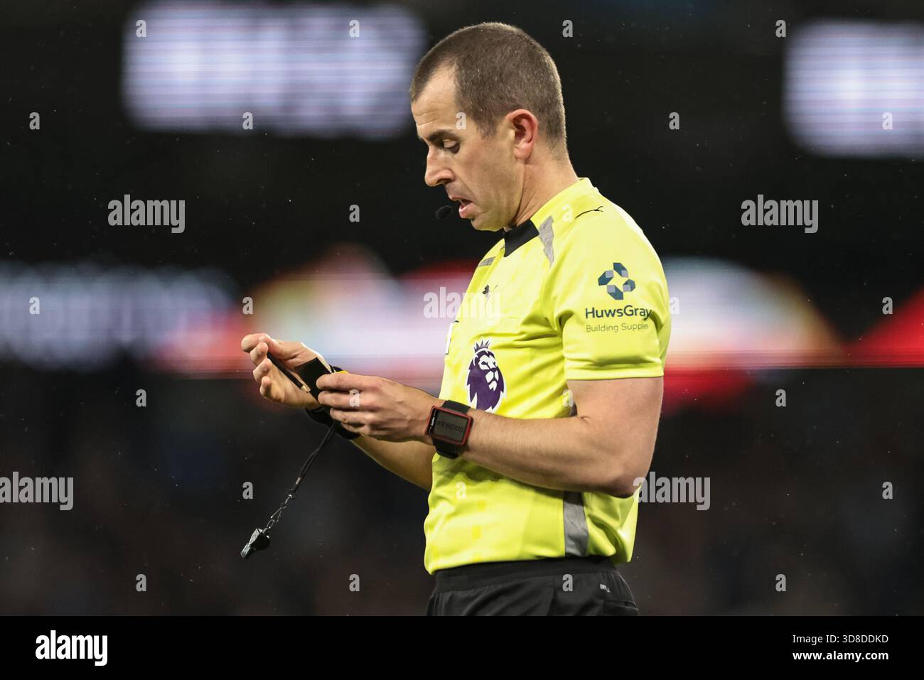 Referee Peter Bankes takes notes in his book during the Premier League ...