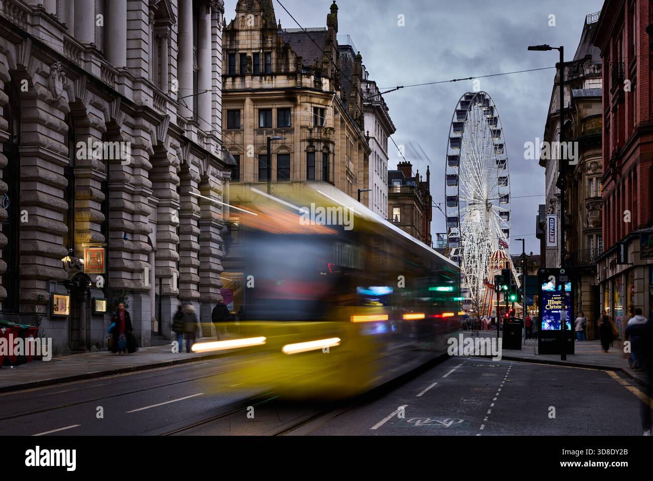 Manchester Metrolink tram on Cross Street in the city centre, with the ...