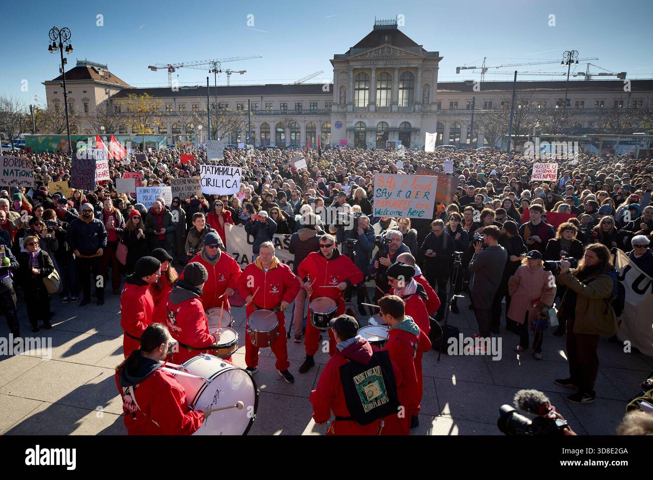 Protesters hold placards during a protest march against the surging far ...