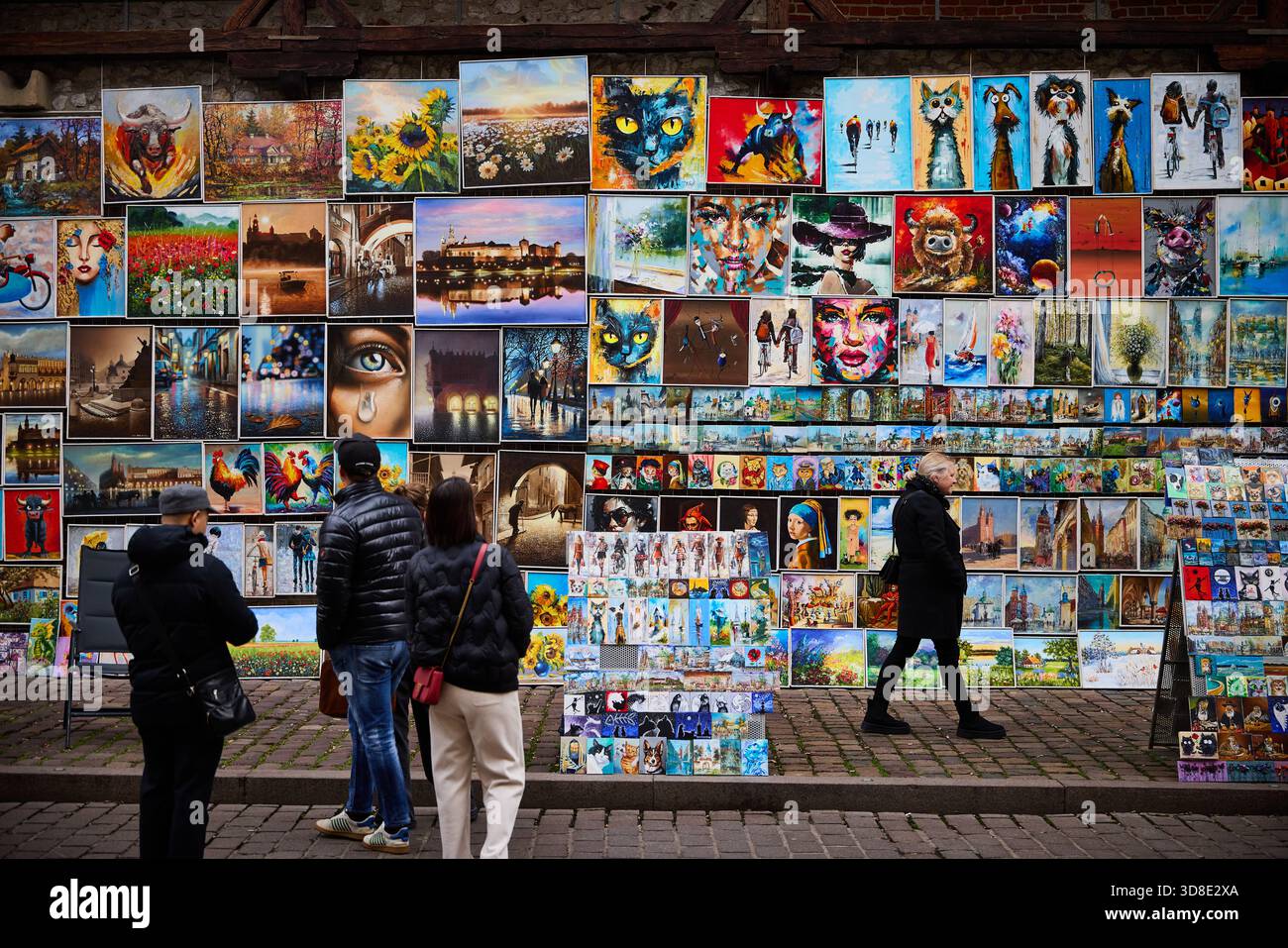 KRAKOW, Poland, Pijarska Art Market outdoor art market features framed ...