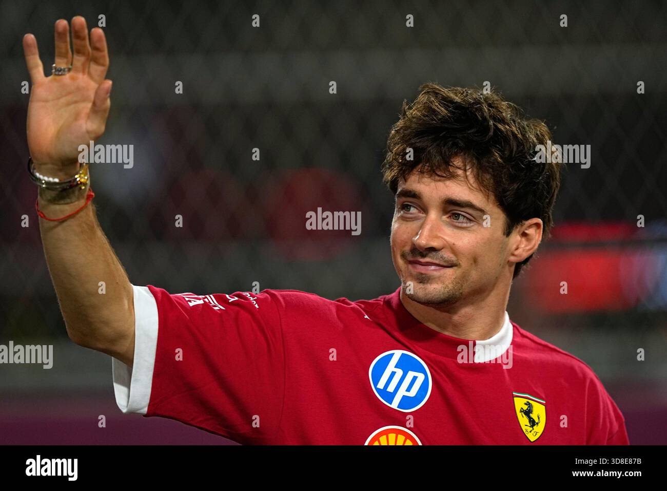 Ferrari driver Charles Leclerc of Monaco waves to supporters during the ...