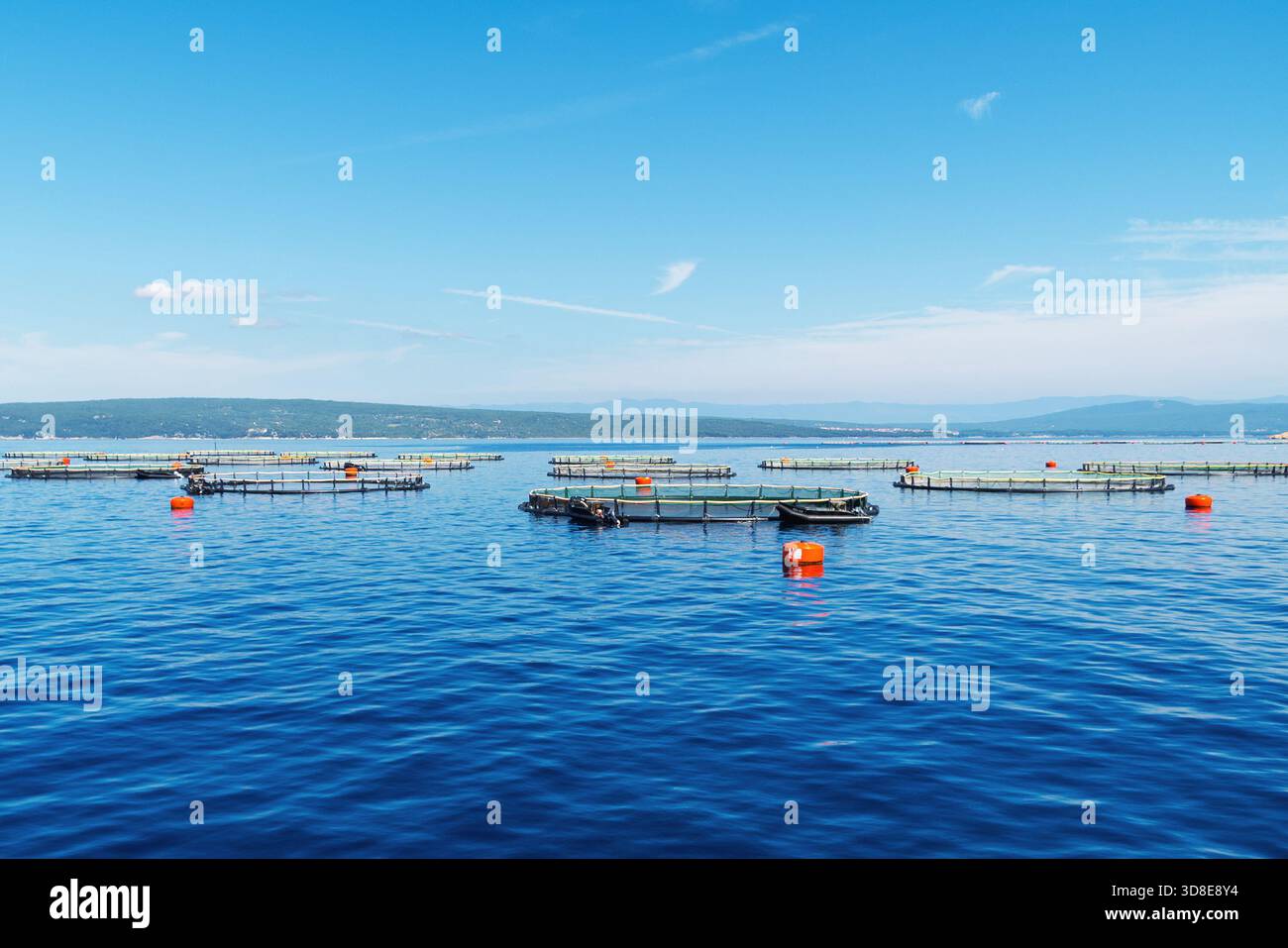 Open sea fish farming platforms in serene ocean landscape Stock Photo ...