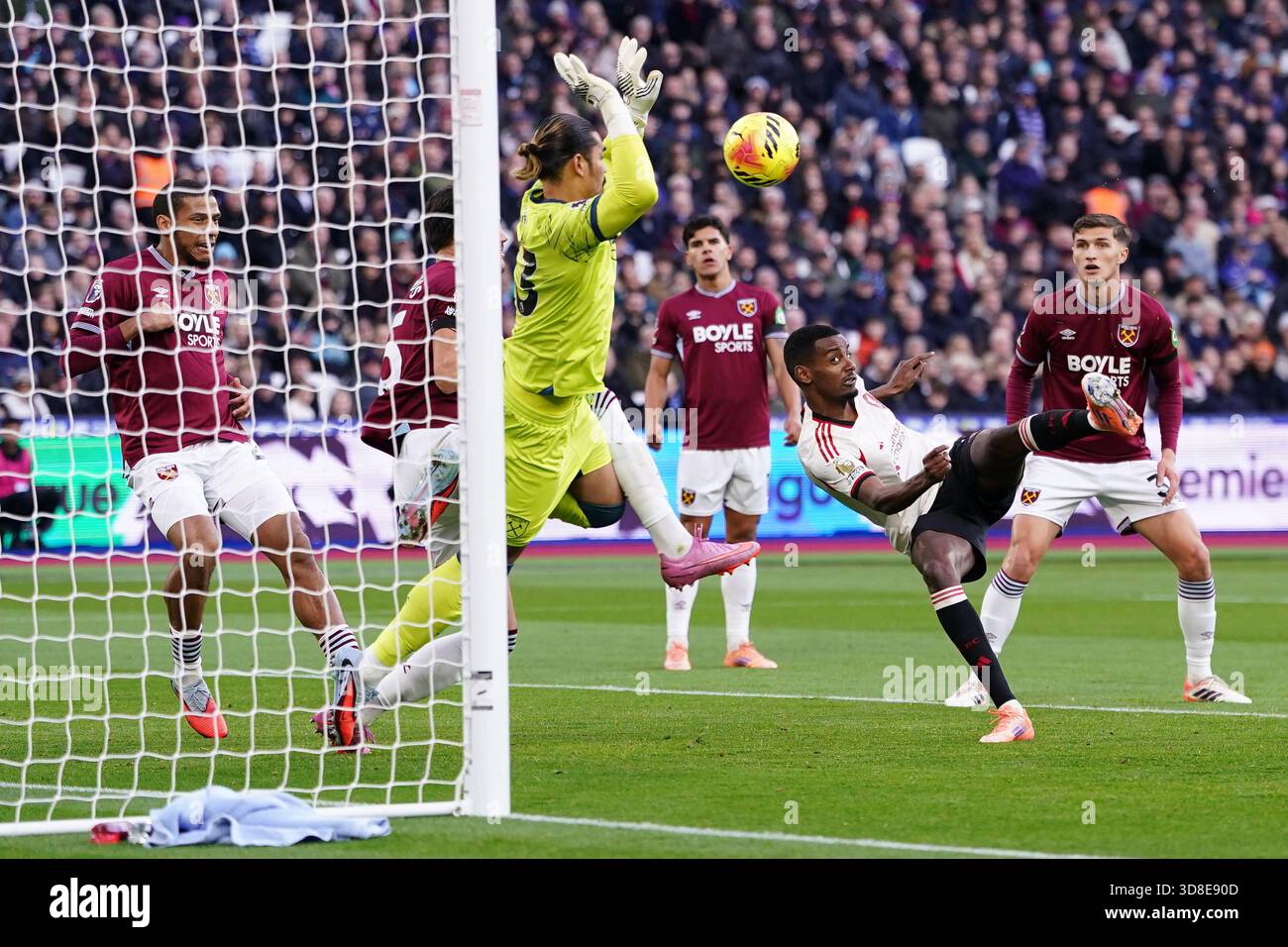 Alphonse Areola of West Ham United denies Alexander Isak of Liverpool ...
