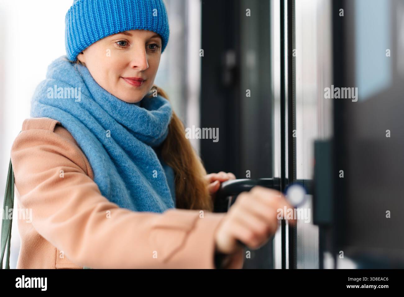 Woman opens front door key hi-res stock photography and images - Alamy