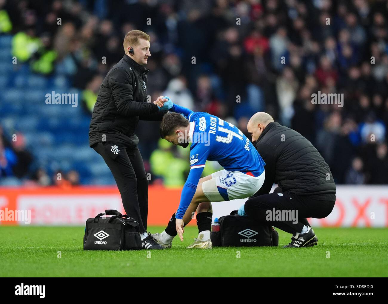 Rangers' Nicolas Raskin receives treatment during the William Hill ...