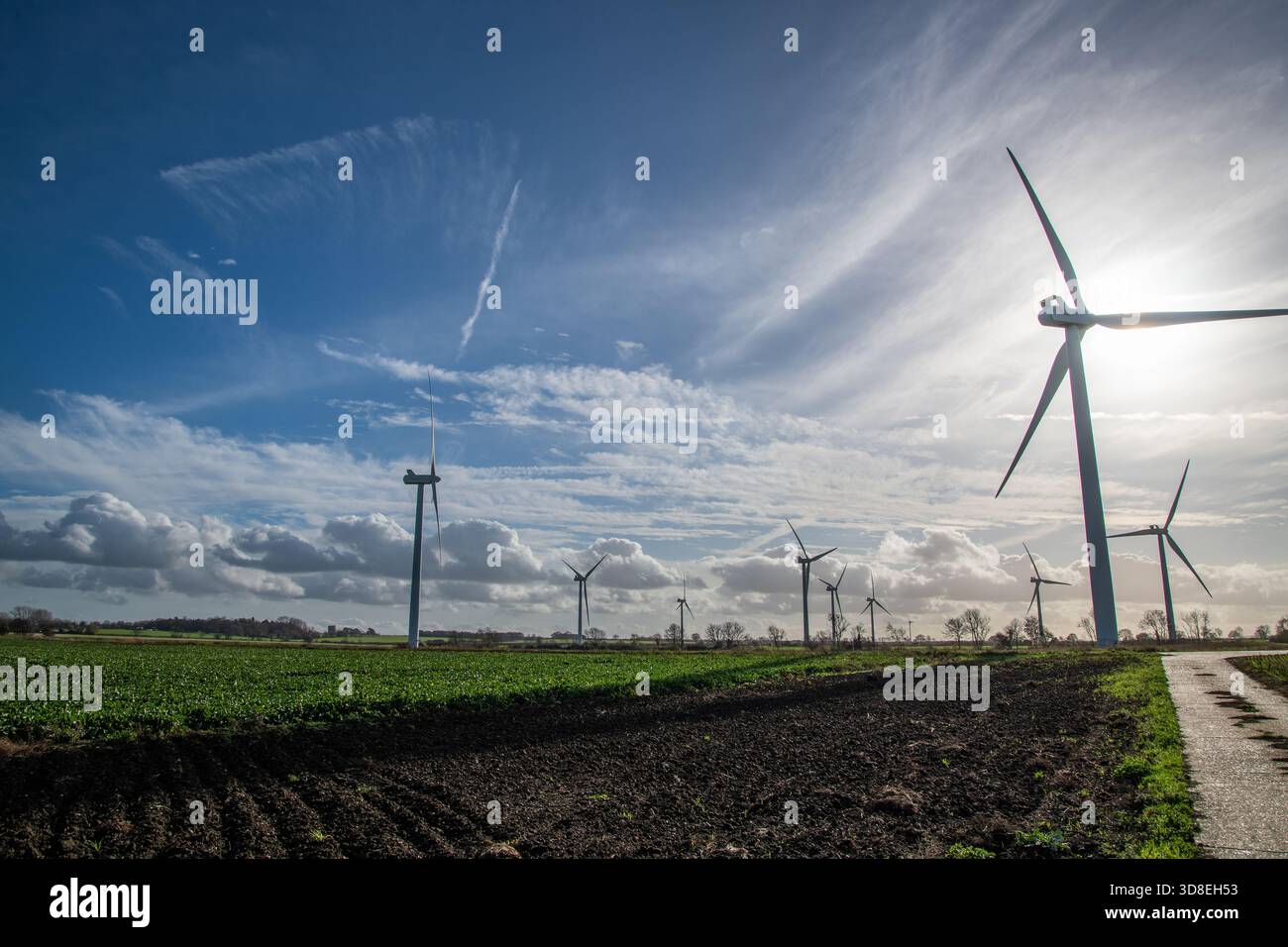 Ground-level close-up photo looking up at a wind turbine in the UK ...