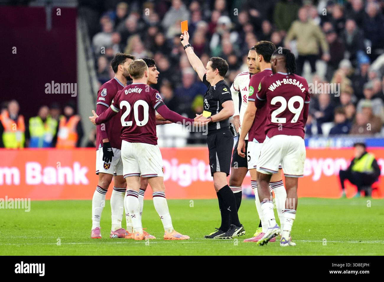 West Ham United's Lucas Paqueta is shown a red card by referee Darren ...