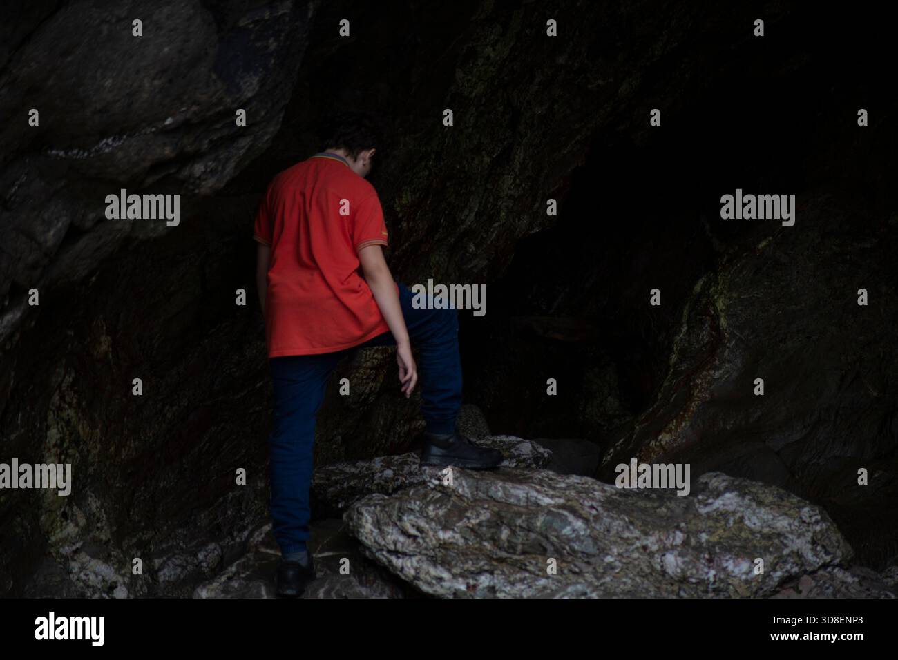 Person standing inside rocky hi-res stock photography and images - Alamy