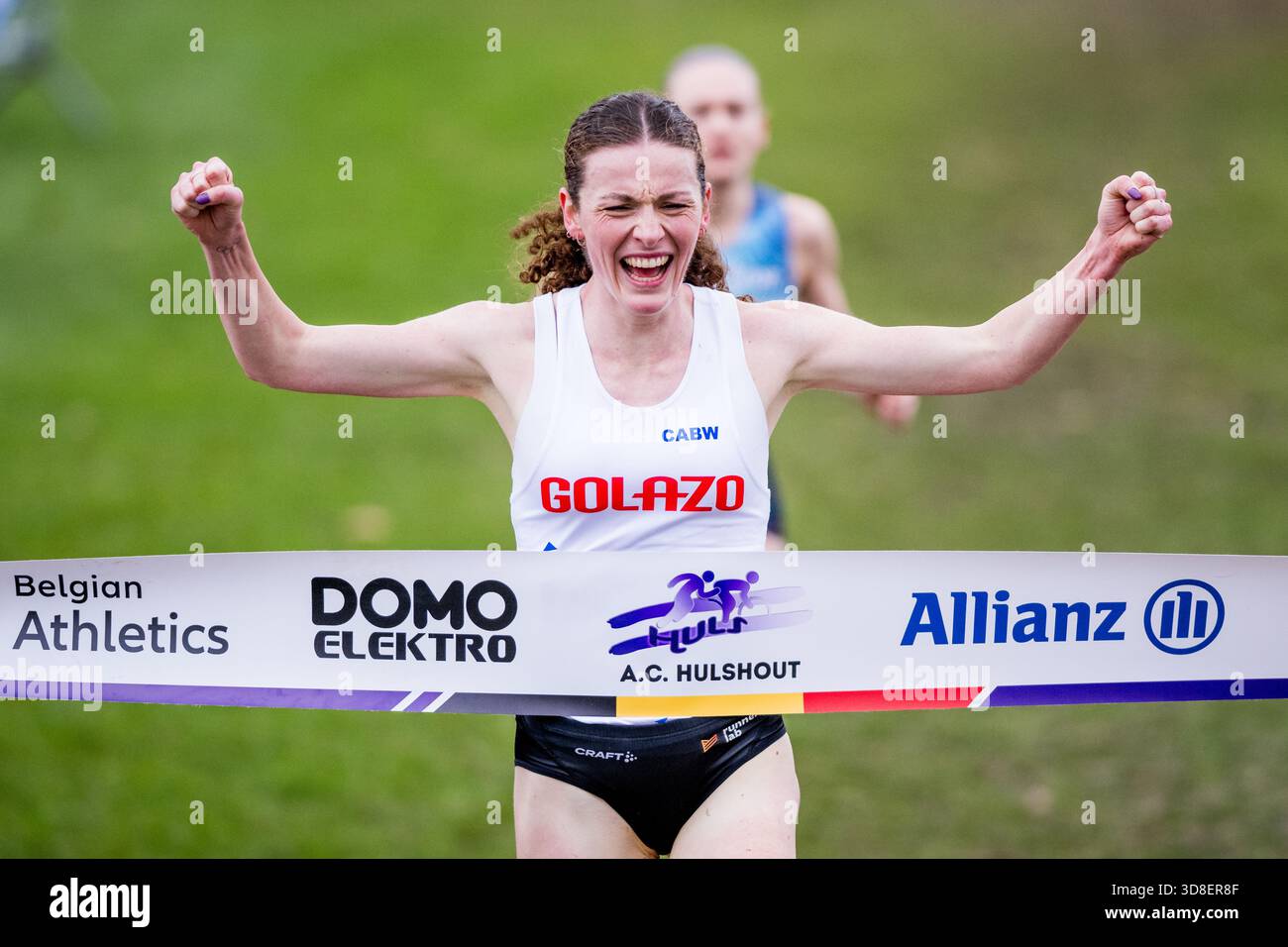 Belgian Lisa Rooms celebrates as she crosses the finish line at the ...