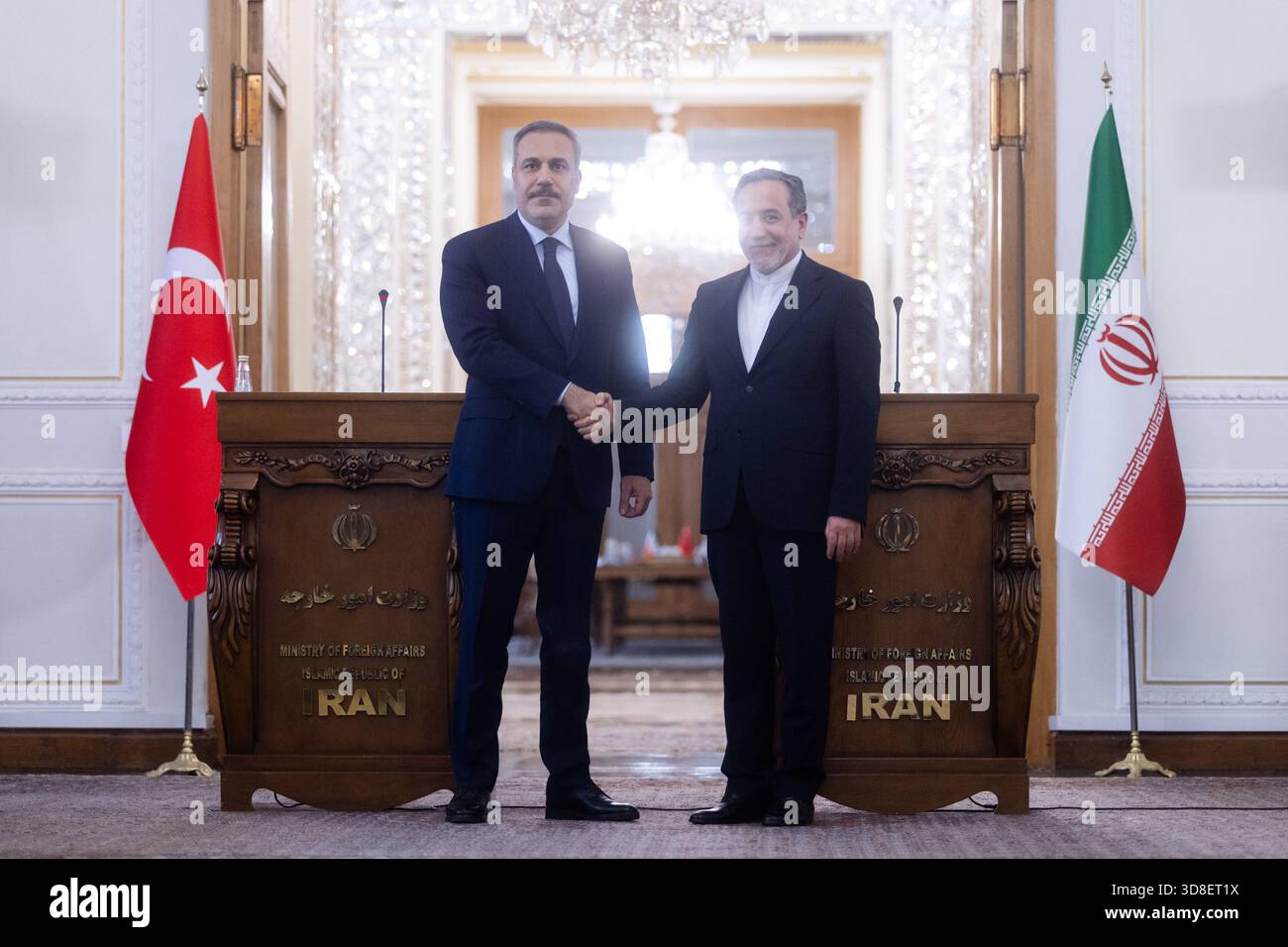 Abbas Araghchi and Hakan Fidan seen shaking hands during a meeting ...
