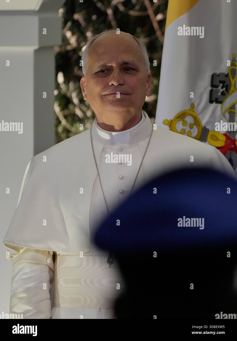 Pope Leo XIV listens to the Vatican anthem during an arrival ceremony ...